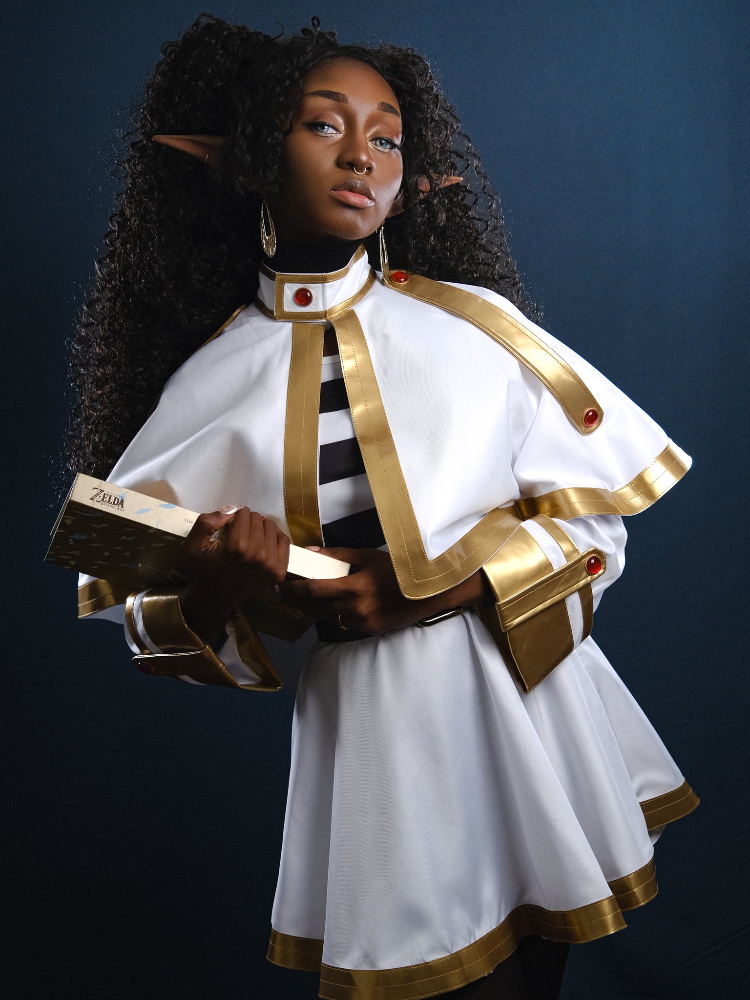 Safebooru - 1girl black hair blue eyes book cosplay curly hair dark-skinned female earrings elf ...